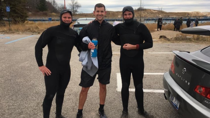 Surfer, Son Rescue Man Swept Off Michigan Pier Into 39-Degree Water ...