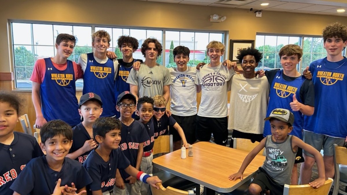 Video captures heartwarming moment as Wheaton basketball players cheer ...