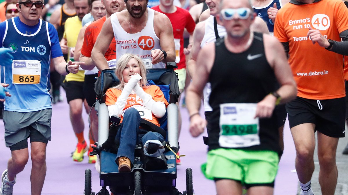Colin Farrell finishes marathon while pushing friend in wheelchair ...