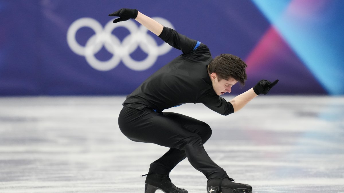 Award moment ensues while Olympic medalist Kyrylo Marsak waits for ...